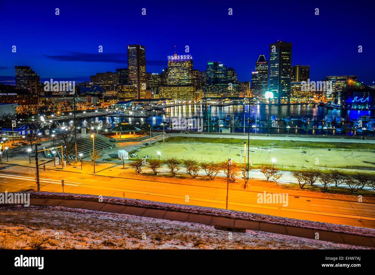 View of the Baltimore skyline and Inner Harbor at night, seen from ...