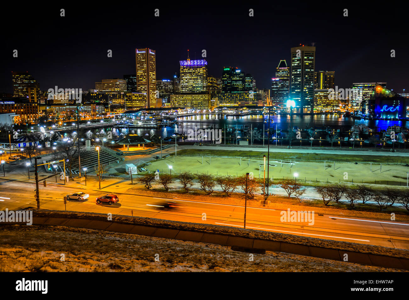 View of the Baltimore skyline and Inner Harbor at night, seen from ...