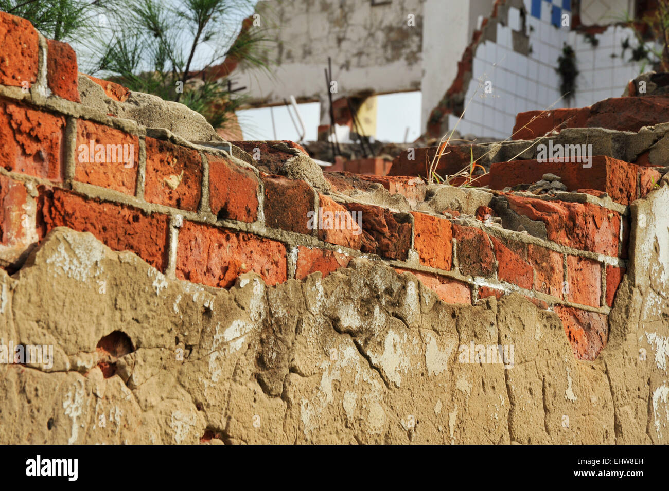 weathered exposed red bricks in damaged wall of old forsaken building ...