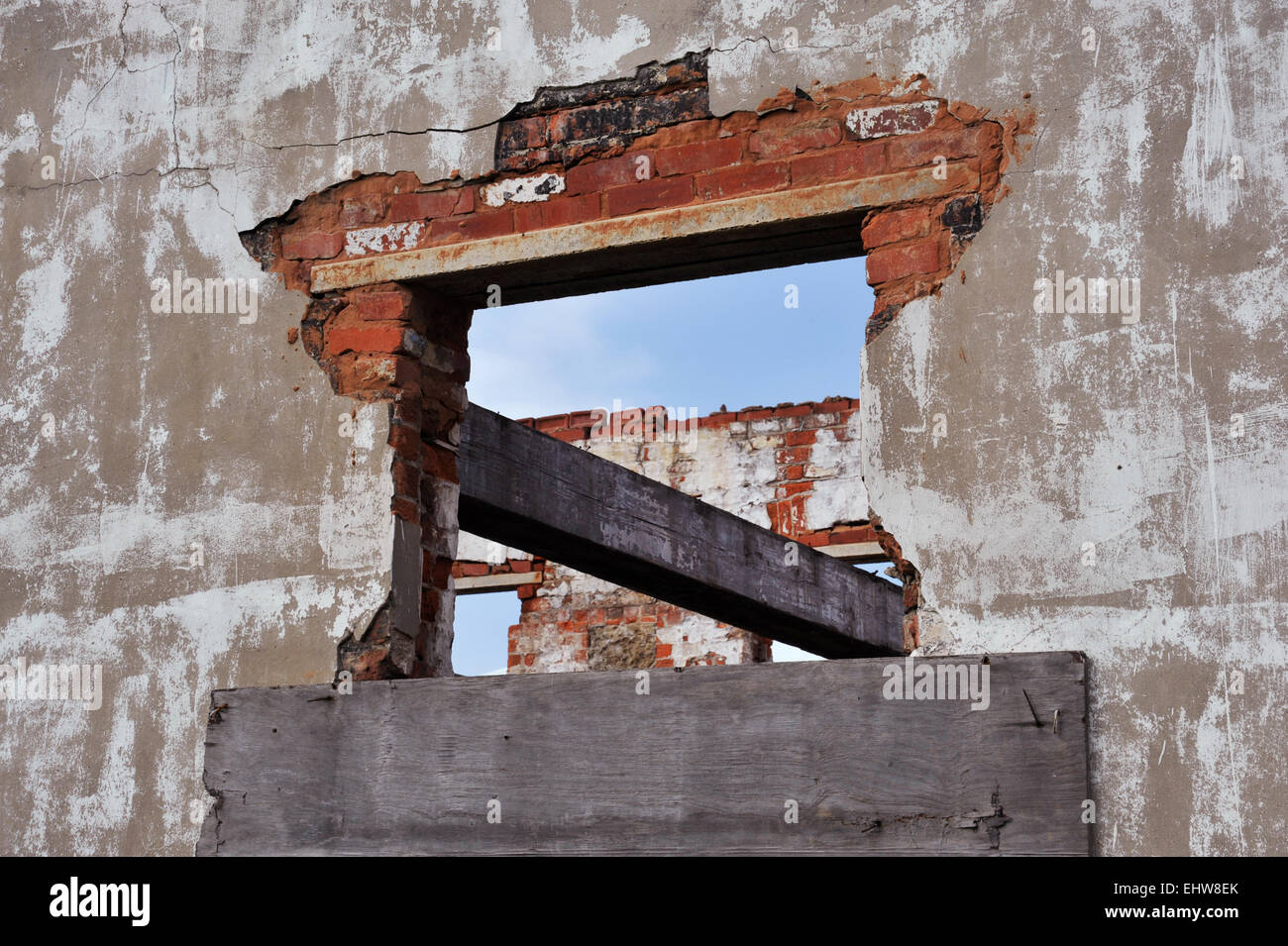 Exposed bricks above window opening of abandoned derelict building ...
