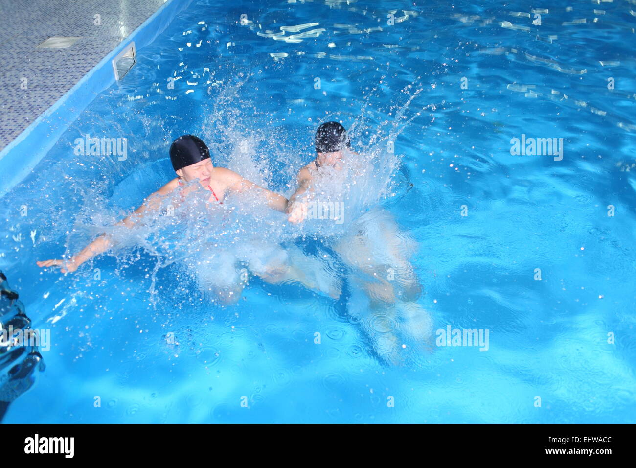 two Woman In Pool Stock Photo - Alamy