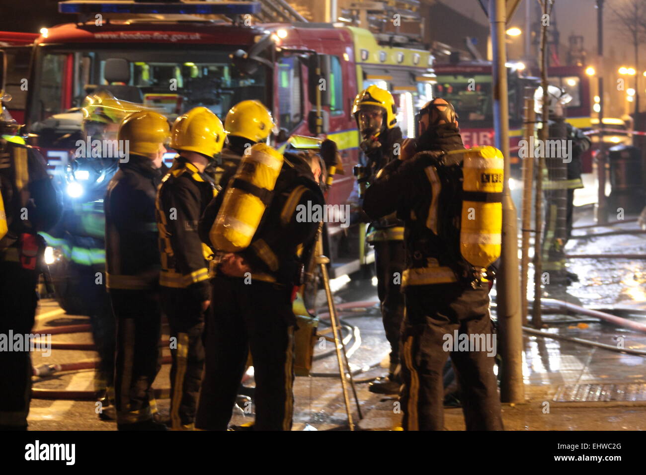 Firefighters using ladders hi-res stock photography and images - Alamy