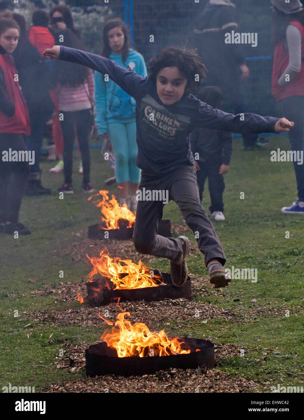 Vancouver, Canada. 17th Mar, 2015. A boy leaps over a bonfire during ...