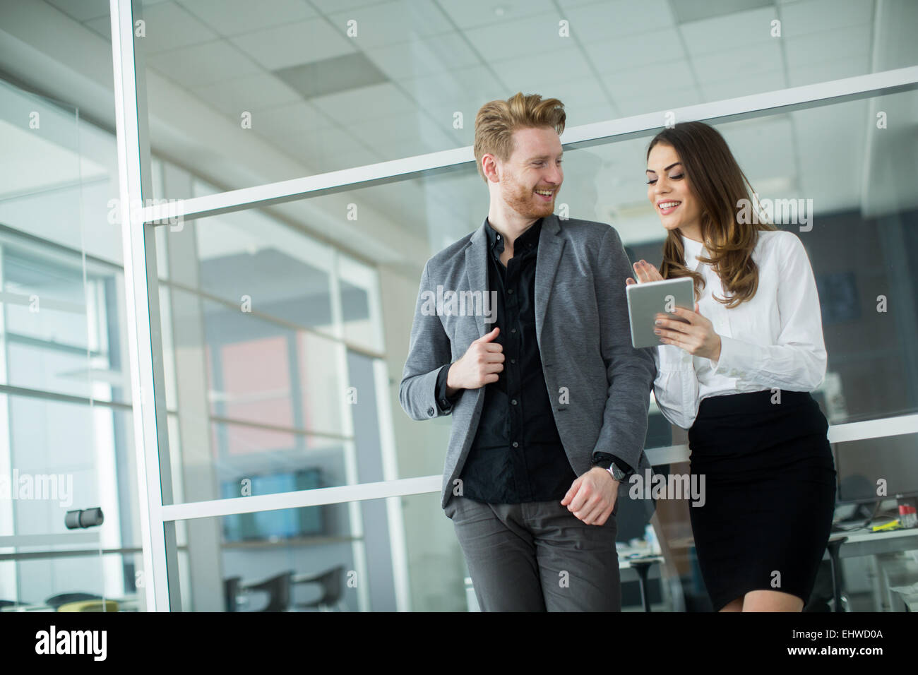Young people in the office Stock Photo - Alamy