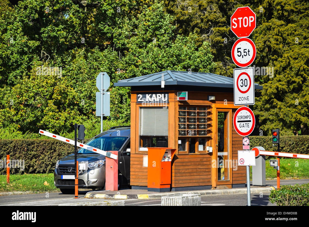 Barriers and road signs at the parking gate entrance Stock Photo - Alamy
