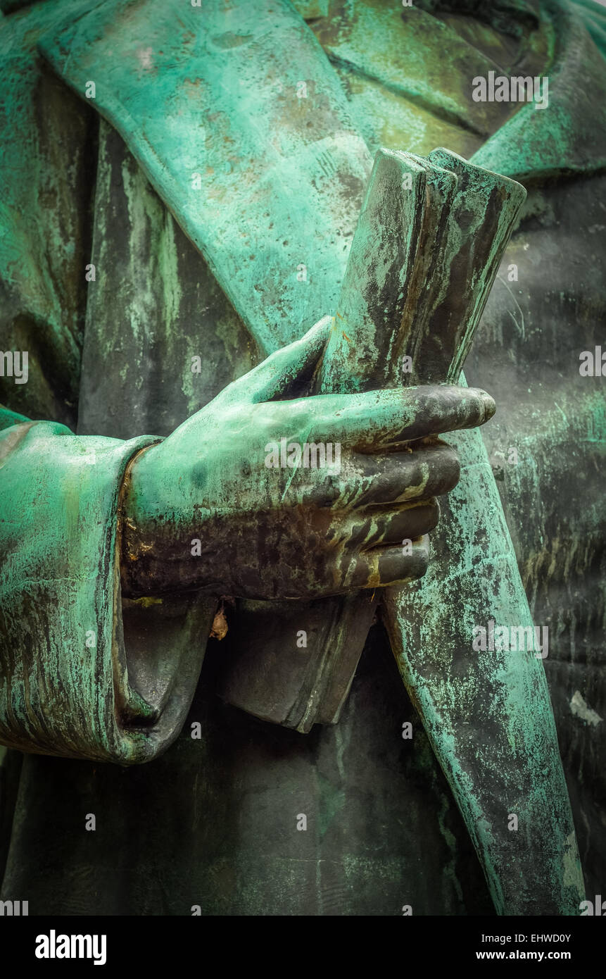 Graduation Image Of Old Statue Holding Academic Scroll Stock Photo - Alamy