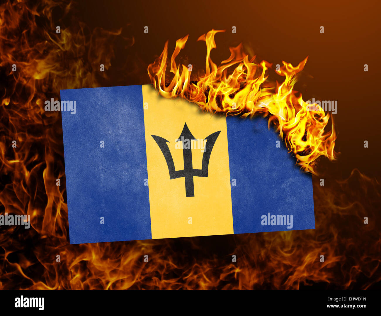 Flag burning - concept of war or crisis - Barbados Stock Photo - Alamy