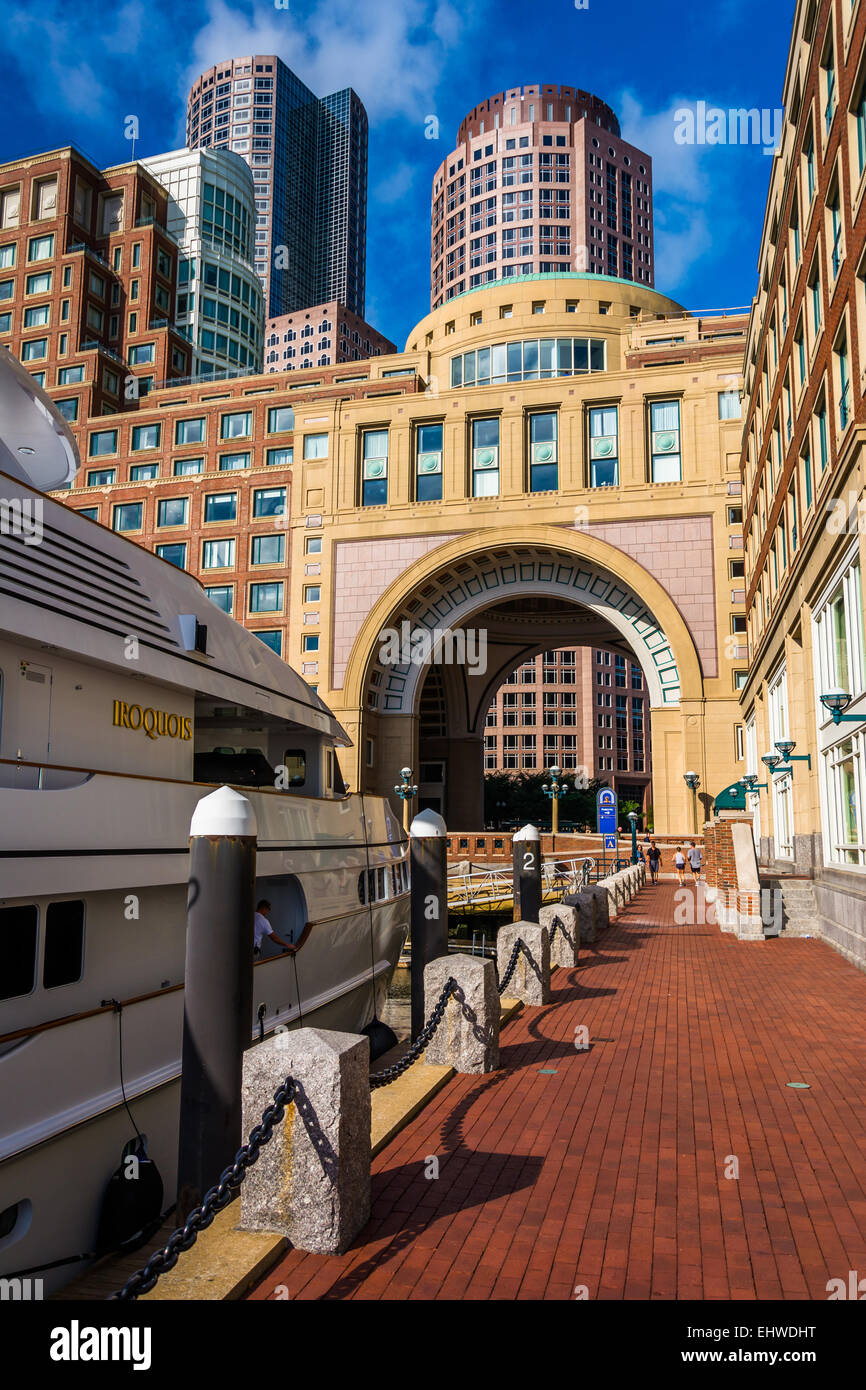 Boat and buildings along the waterfront in Rowes Wharf, Boston ...