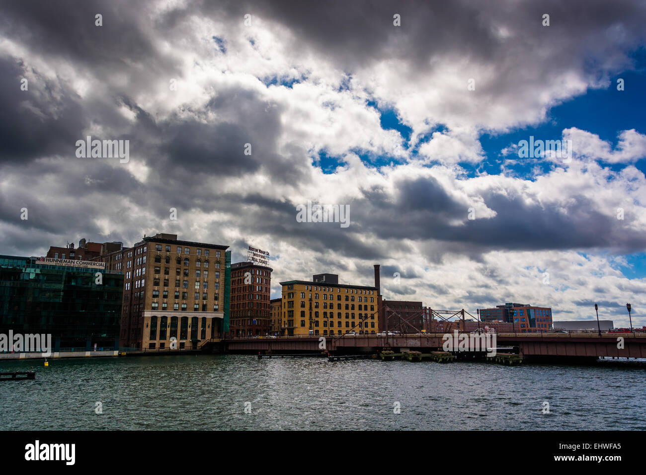 Cloudy sky over Fort Point Channel and old buildings in Boston ...