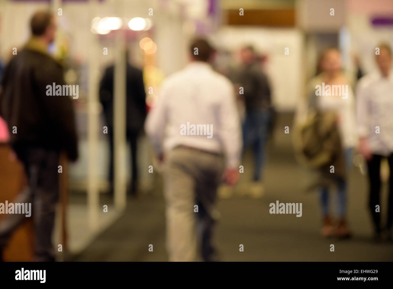 Out of focus man walking in shopping mall Stock Photo - Alamy