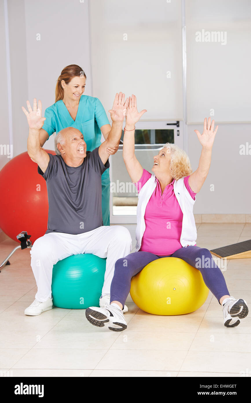 Two senior citizens doing sports in physiotherapy during rehab Stock ...