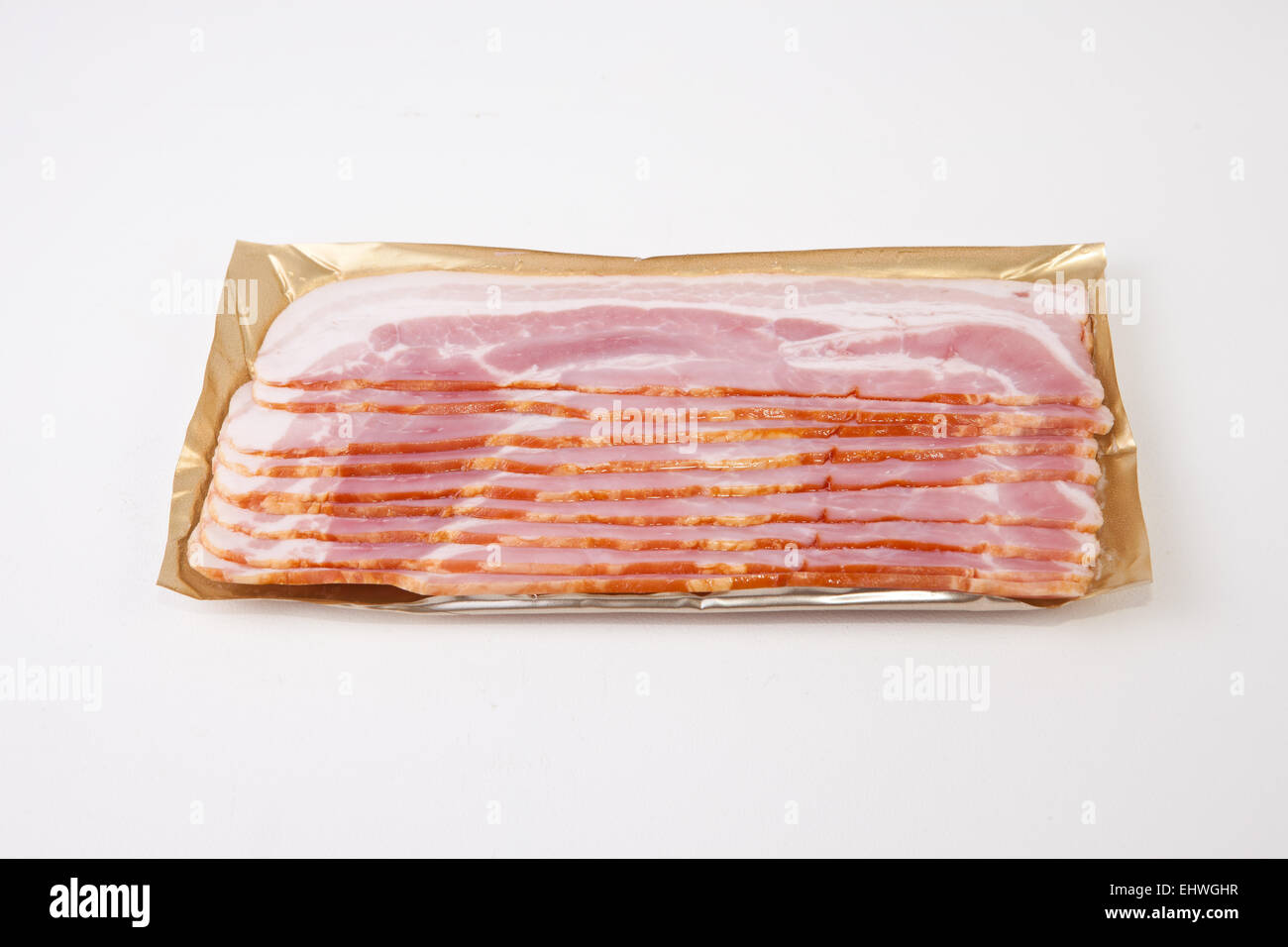 Bacon slices on the package, isolated on white background Stock Photo ...
