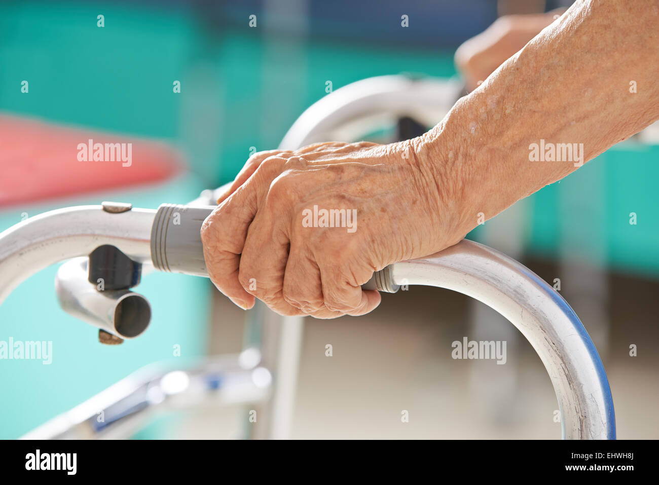 Old senior hands holding on to a walker for support Stock Photo - Alamy