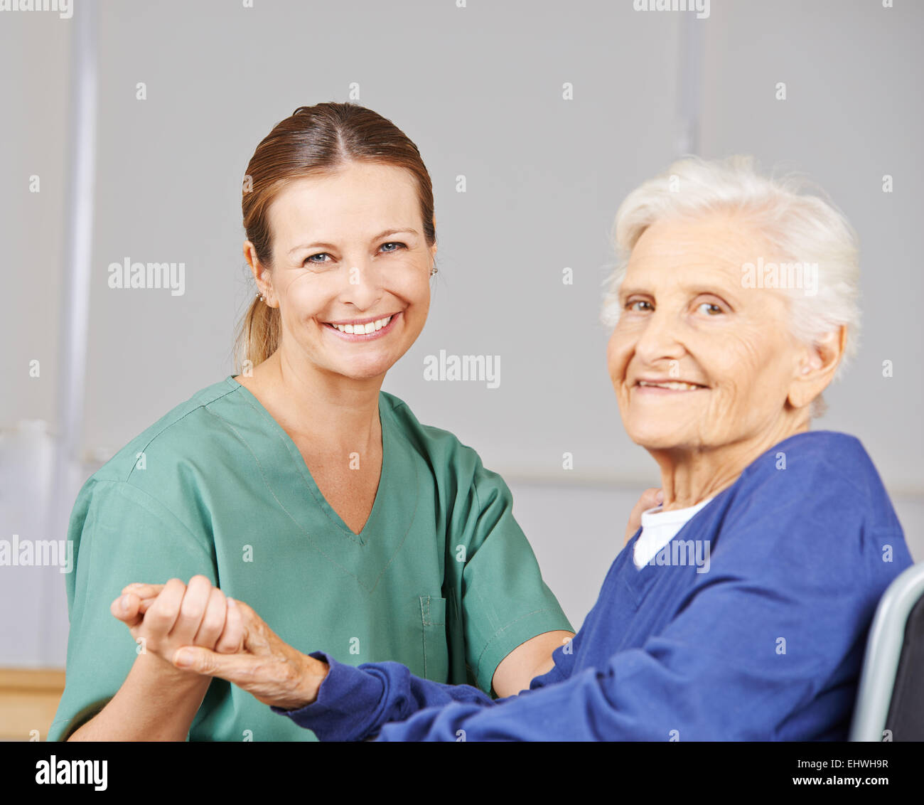 Old smiling senior woman with geriatric nurse in a nursing home Stock ...