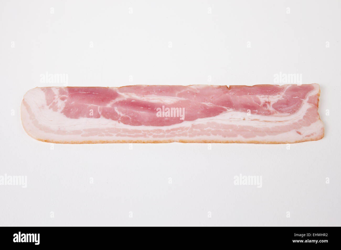 Raw bacon slice isolated on white background Stock Photo - Alamy