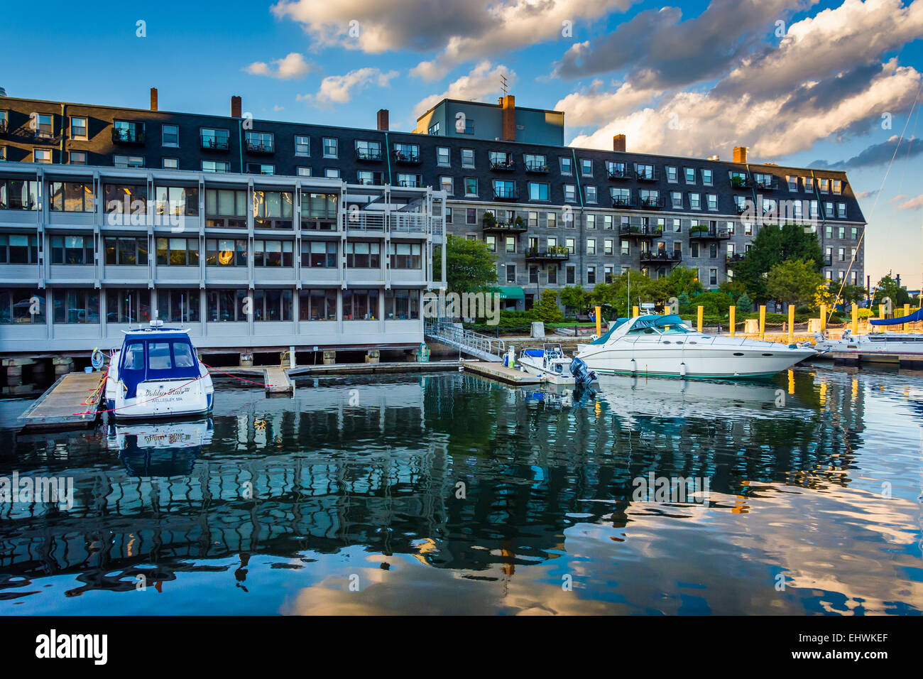 Lewis Wharf and boats reflecting in the Boston Inner Harbor, in Boston ...