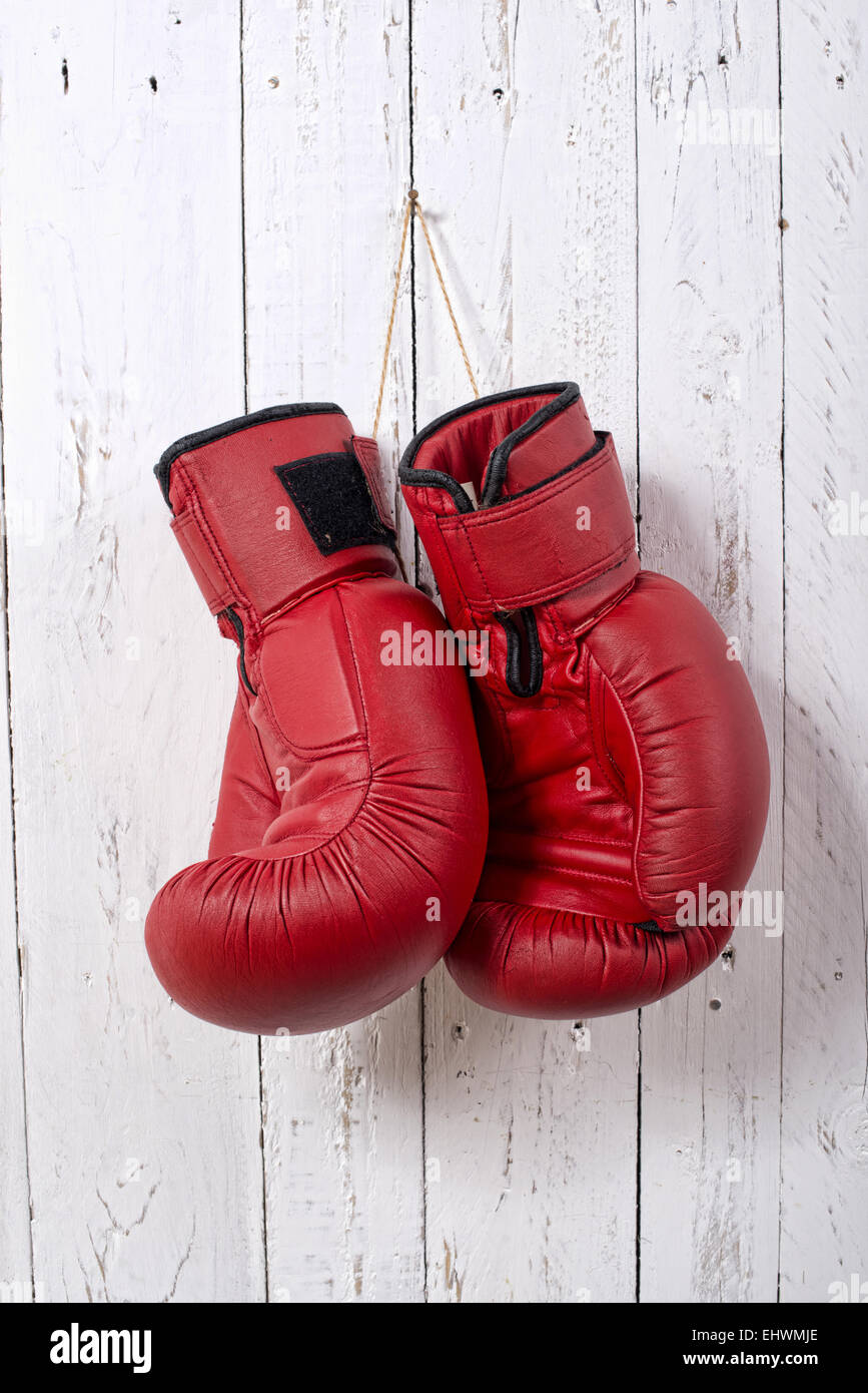 red boxing gloves hanging on the wall Stock Photo - Alamy