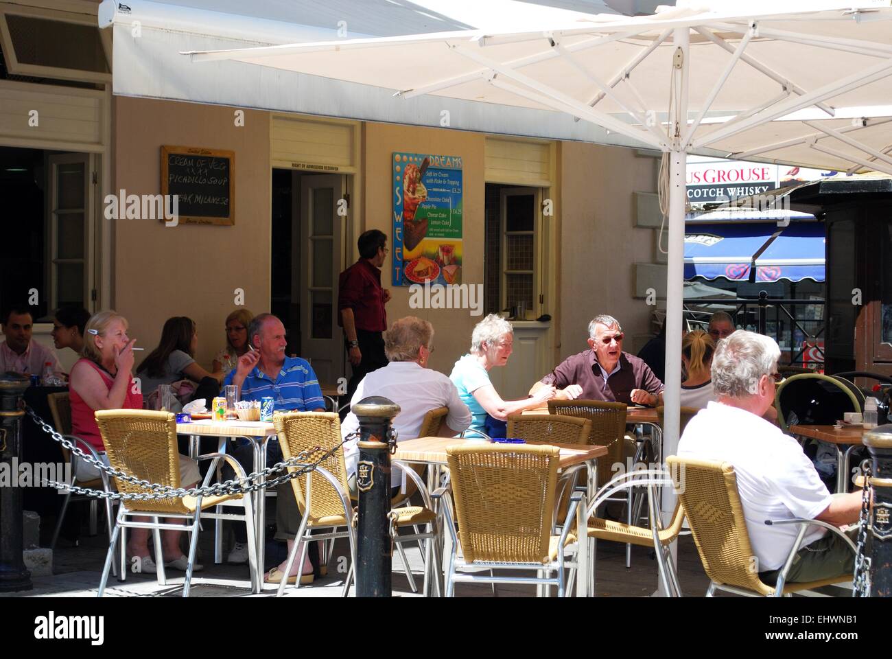 Tourists relaxing at a pavement cafe along Main Street, Gibraltar ...