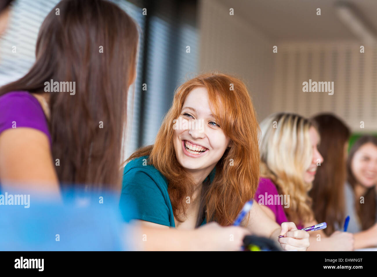 Students in a classroom during class (color toned image; shallow DOF ...