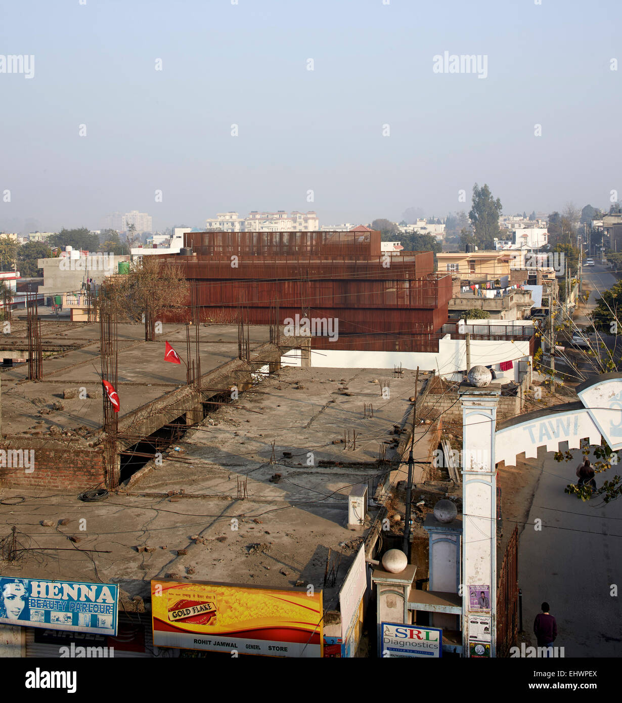 Sunny view from high level showing compound entrance in foreground. The ...