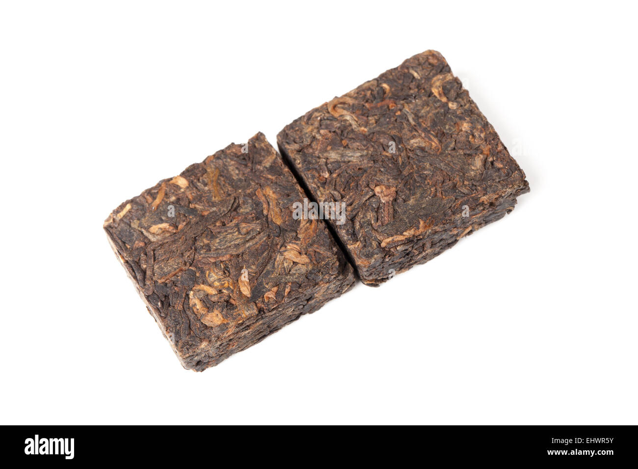 Two small pressing briquette of black Chinese Shu Pu-erh tea isolated ...