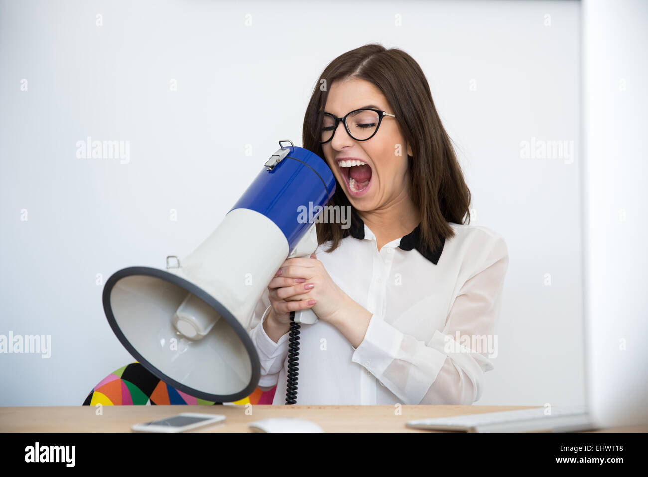 Woman megaphone office hi-res stock photography and images - Alamy