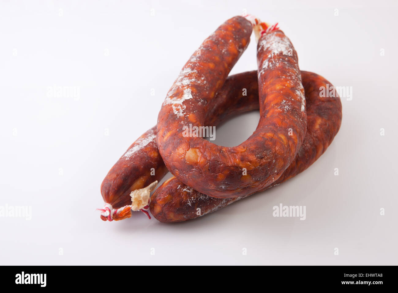 Two red spanish chorizos. Isolated over white background Stock Photo ...