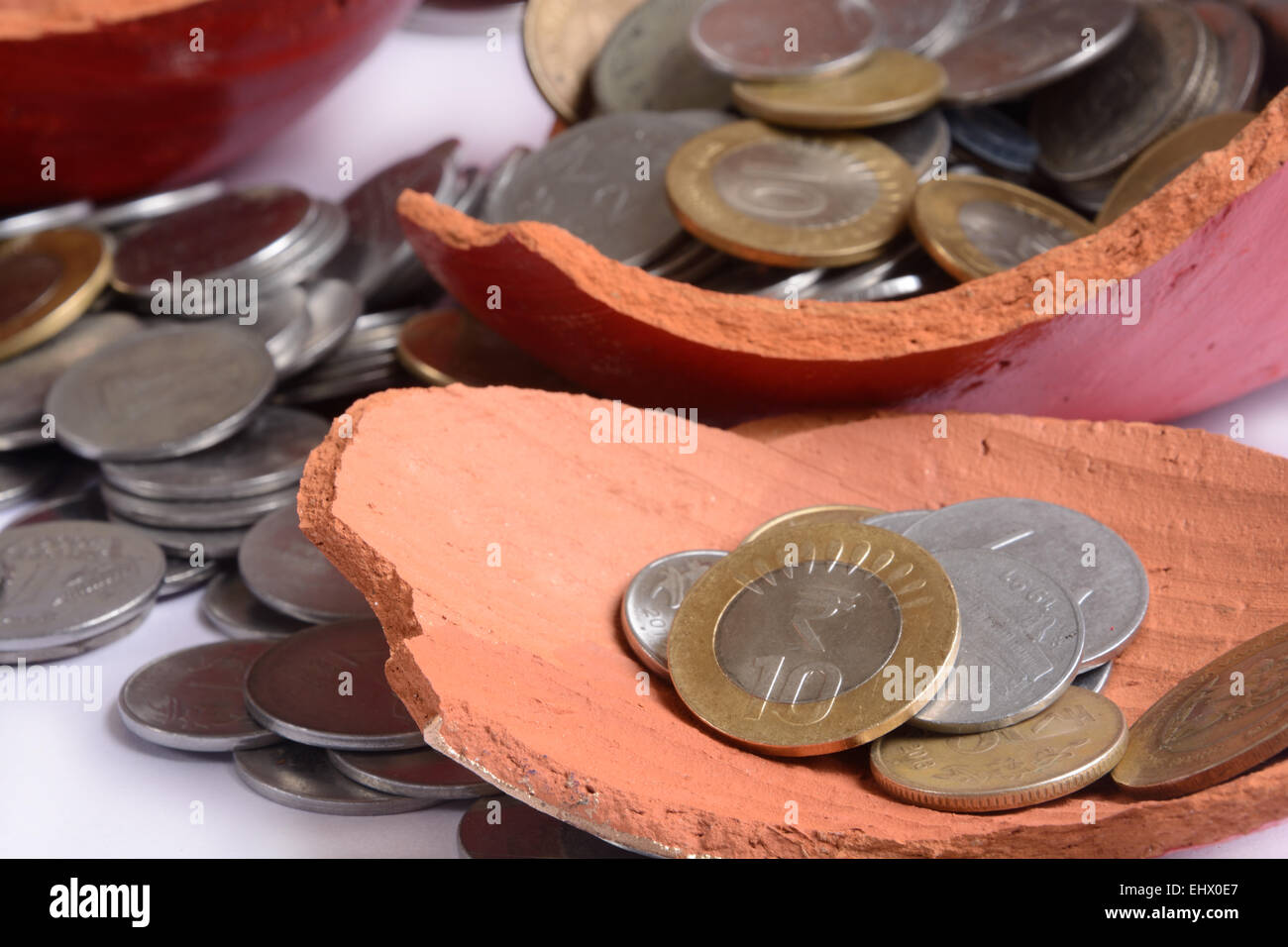 Earthen pot is a coin box of rural India called Gullak Stock Photo - Alamy