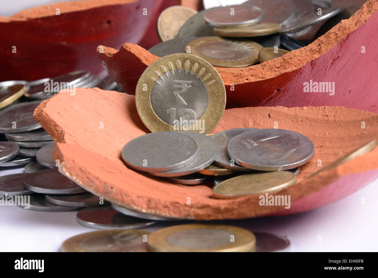 Earthen pot is a coin box of rural India called Gullak Stock Photo - Alamy