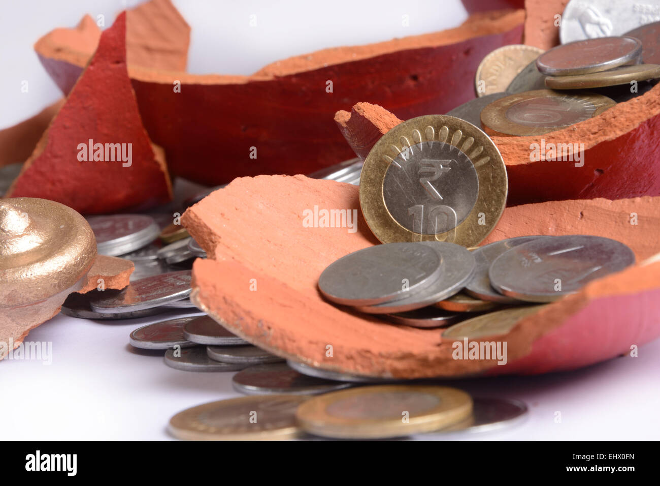 Earthen pot is a coin box of rural India called Gullak Stock Photo - Alamy