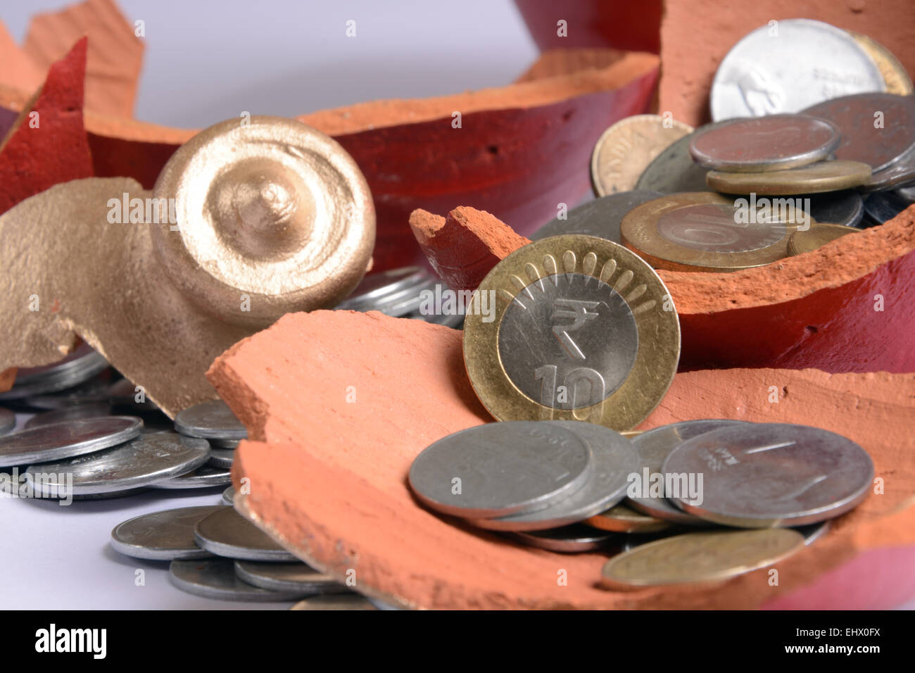 Earthen pot is a coin box of rural India called Gullak Stock Photo - Alamy