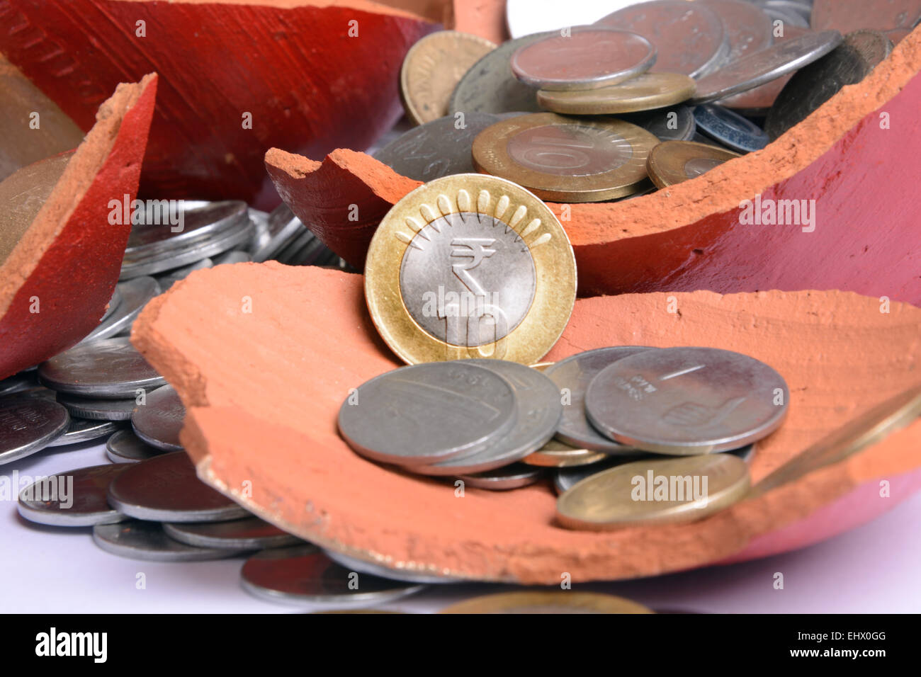 Earthen pot is a coin box of rural India called Gullak Stock Photo - Alamy