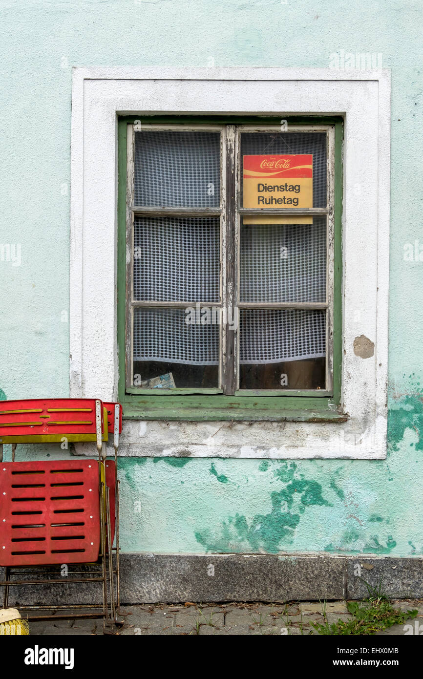 Window of guesthouse with sign 'Tuesday Closing day' Stock Photo - Alamy