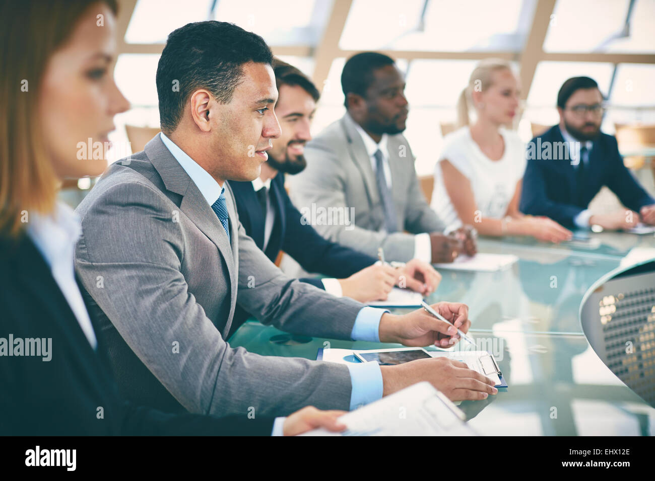 Business people sitting in conference hall Stock Photo - Alamy