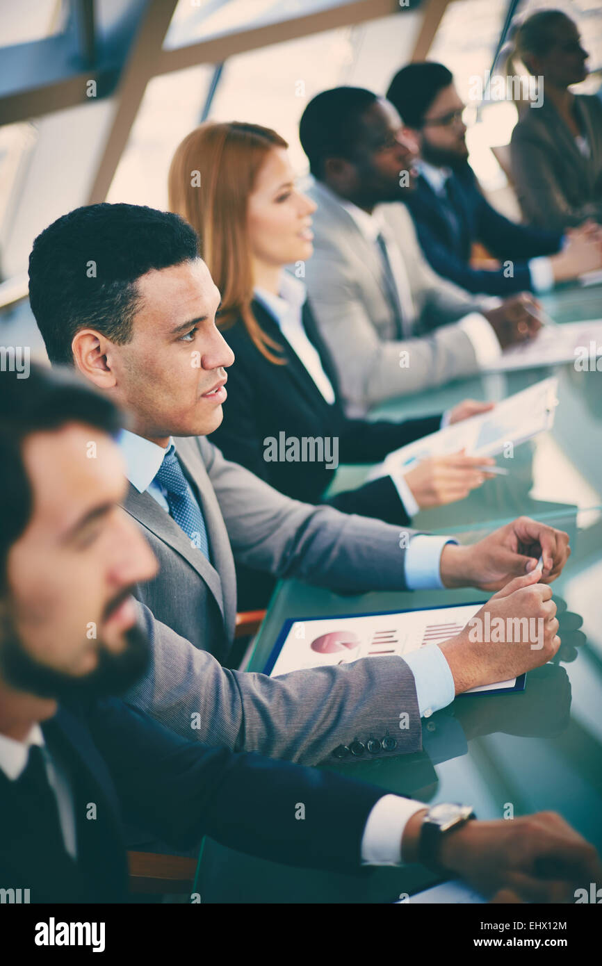 Row of people hi-res stock photography and images - Alamy