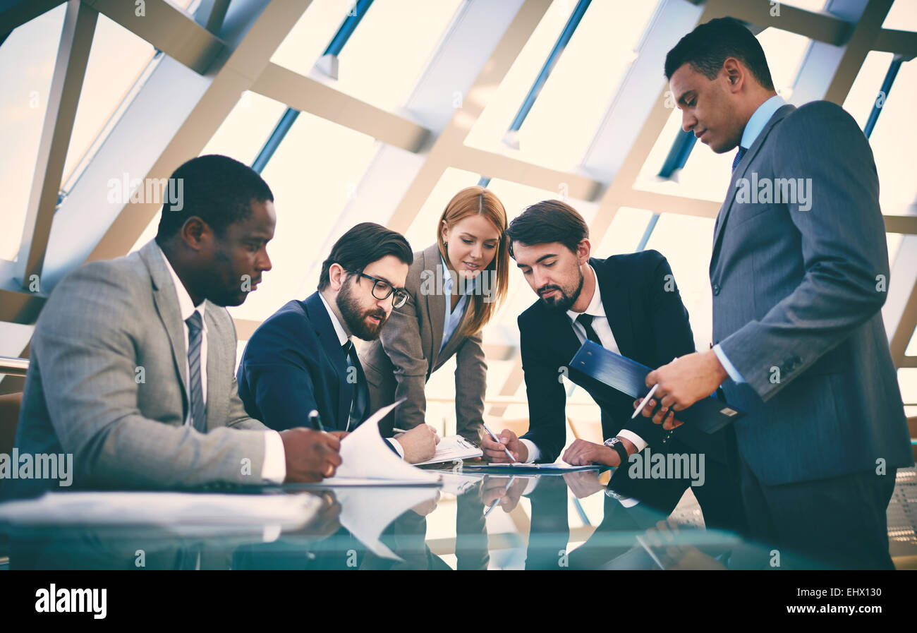 Business people signing papers Stock Photo - Alamy