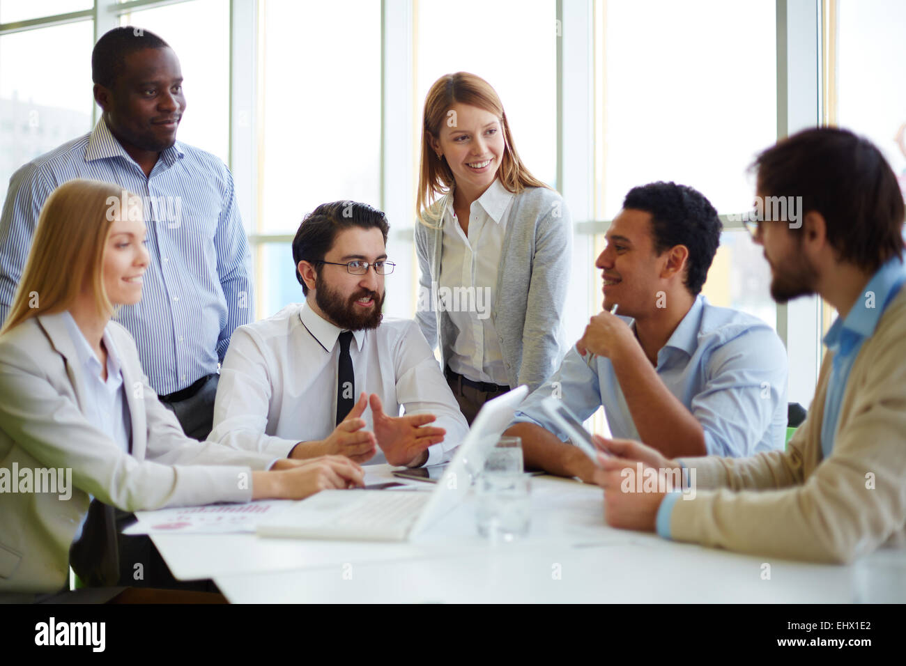 Chief gathering his workers in boardroom Stock Photo - Alamy