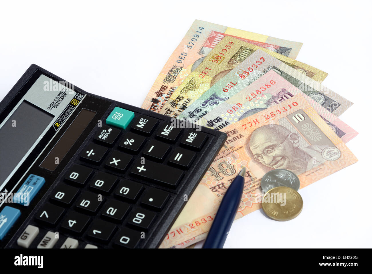 Pen and calculator with money Stock Photo - Alamy
