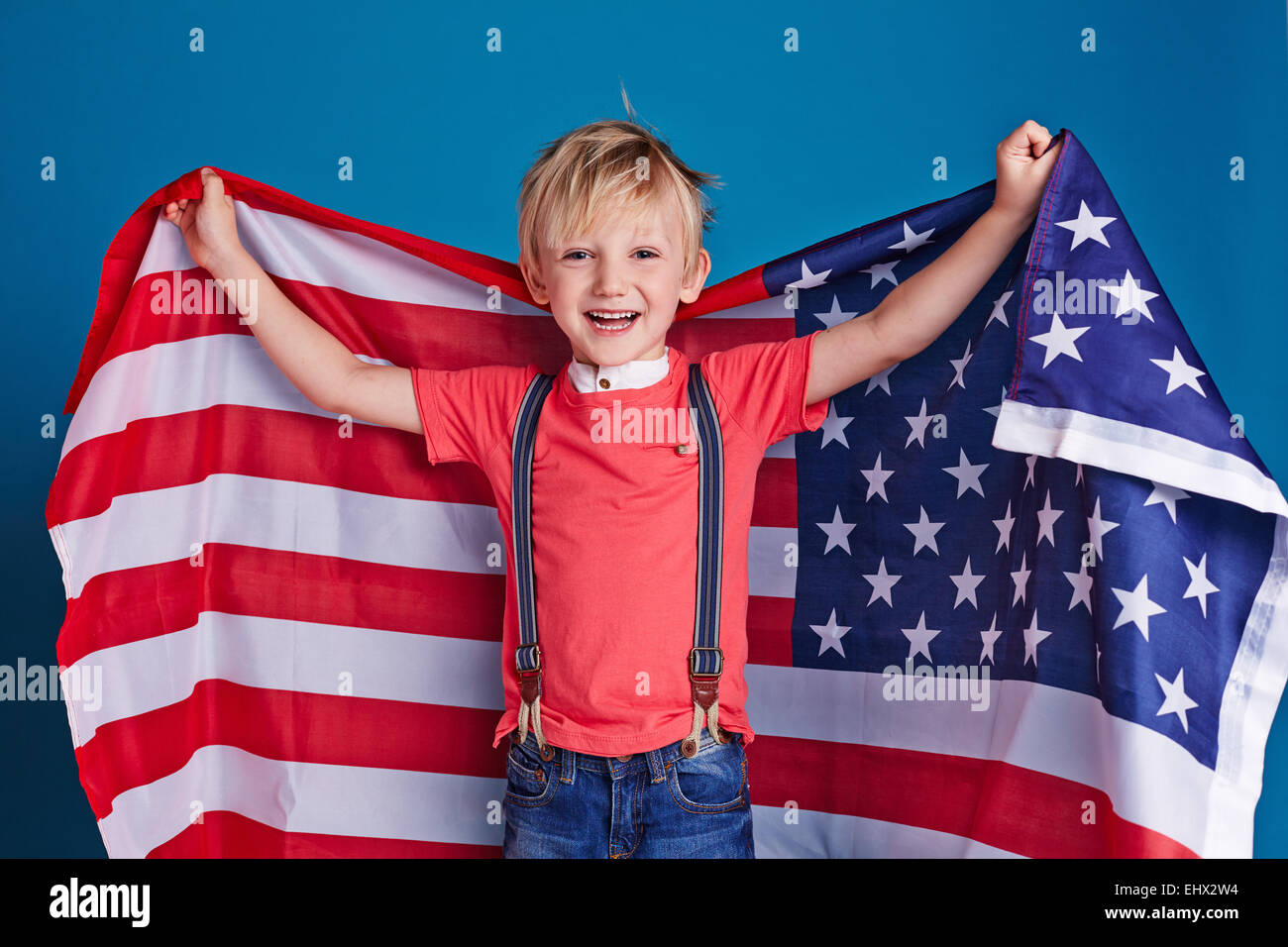 Little boy cheering with American flag Stock Photo - Alamy
