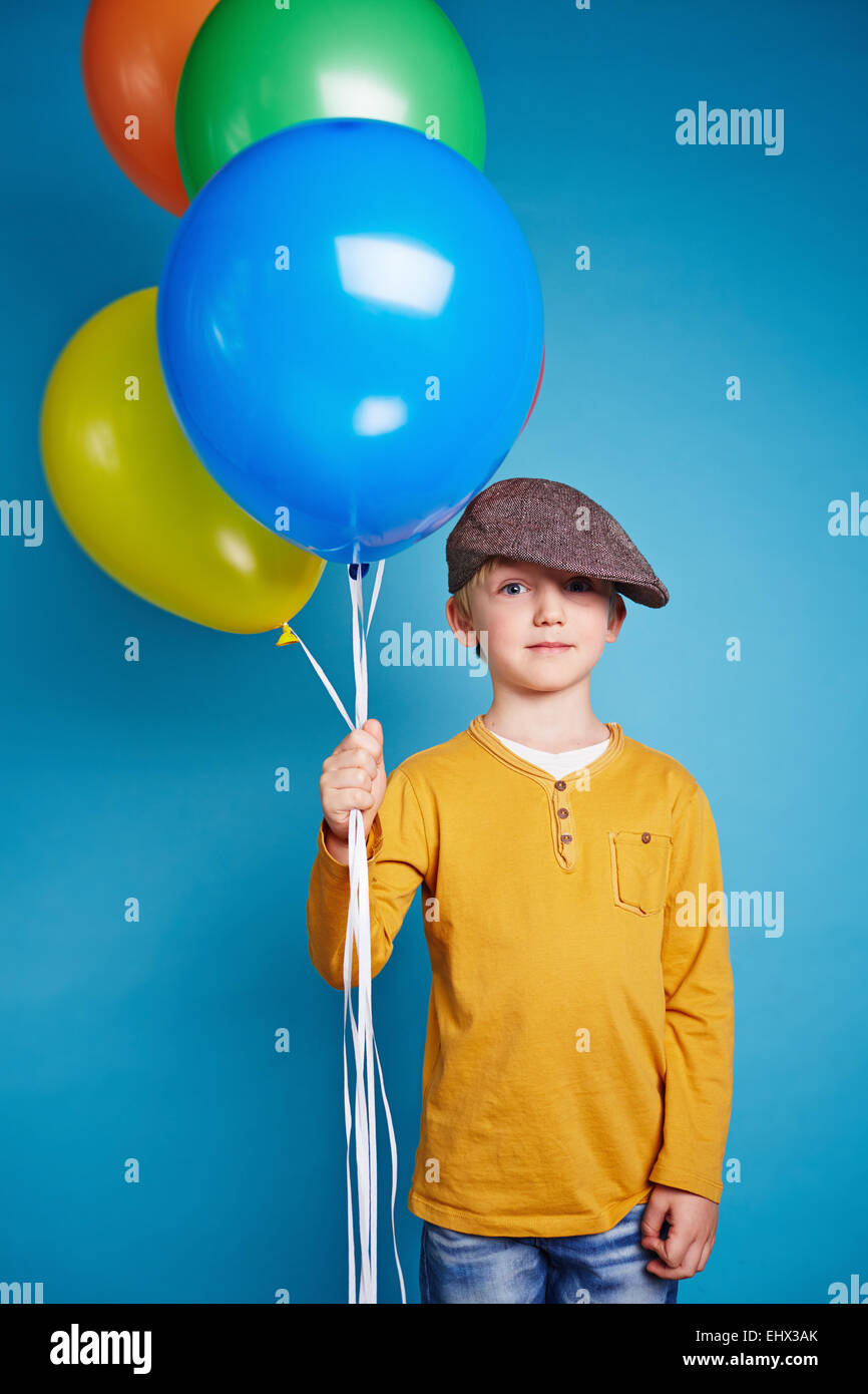 Boy with multicolored balloons Stock Photo - Alamy