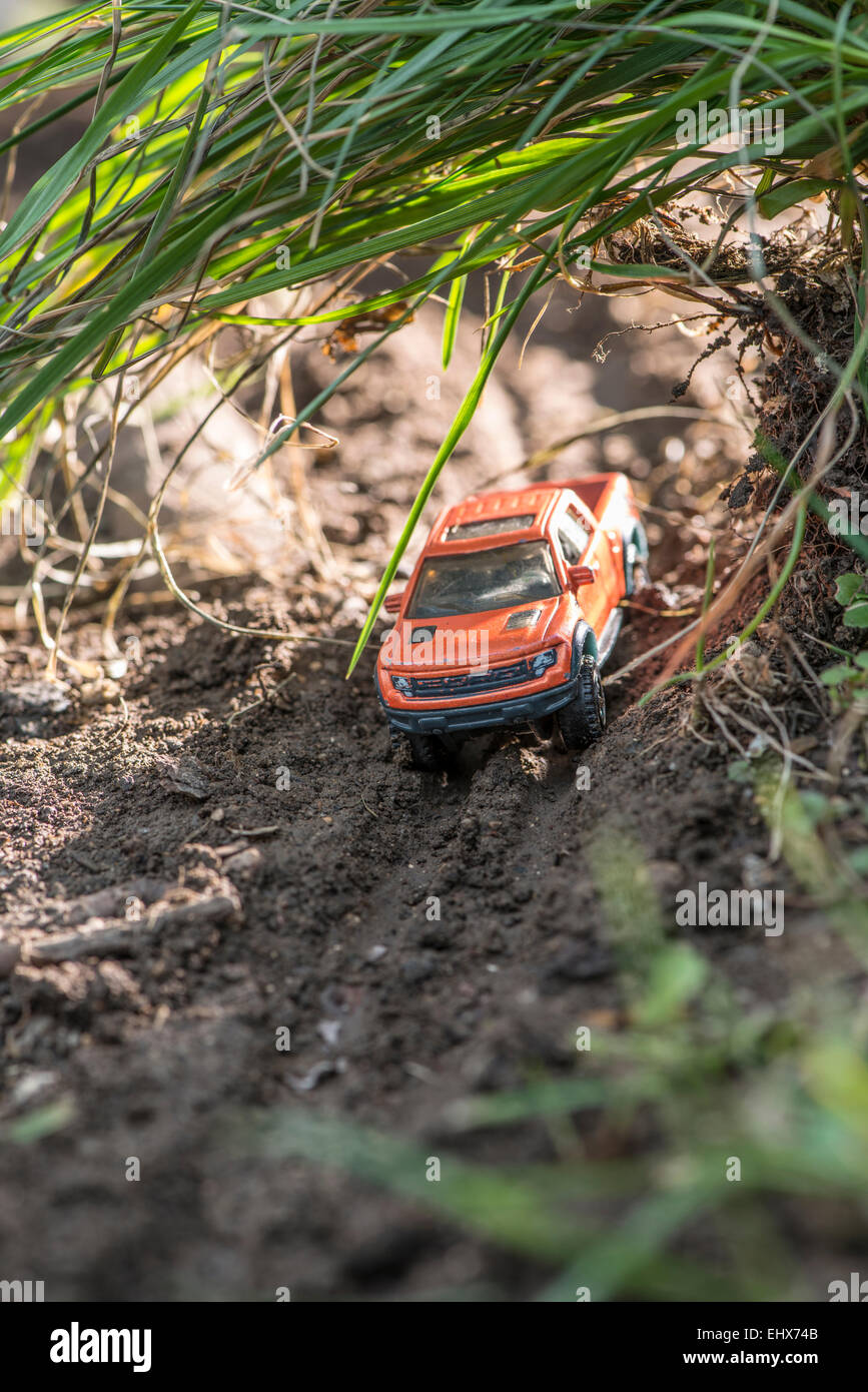 Small red off road toy car in nature Stock Photo - Alamy