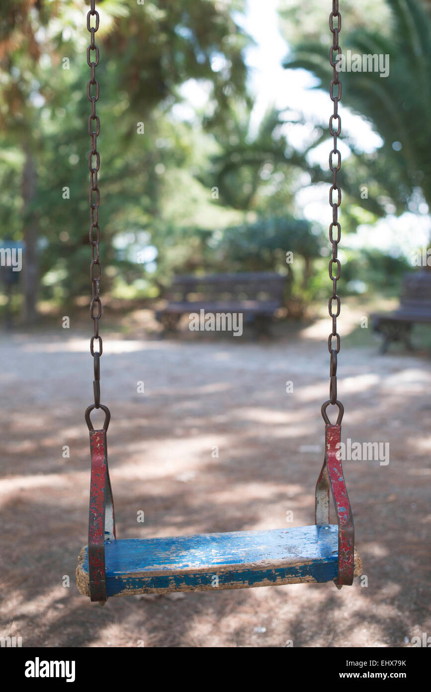 Greece, old swing at playground Stock Photo - Alamy