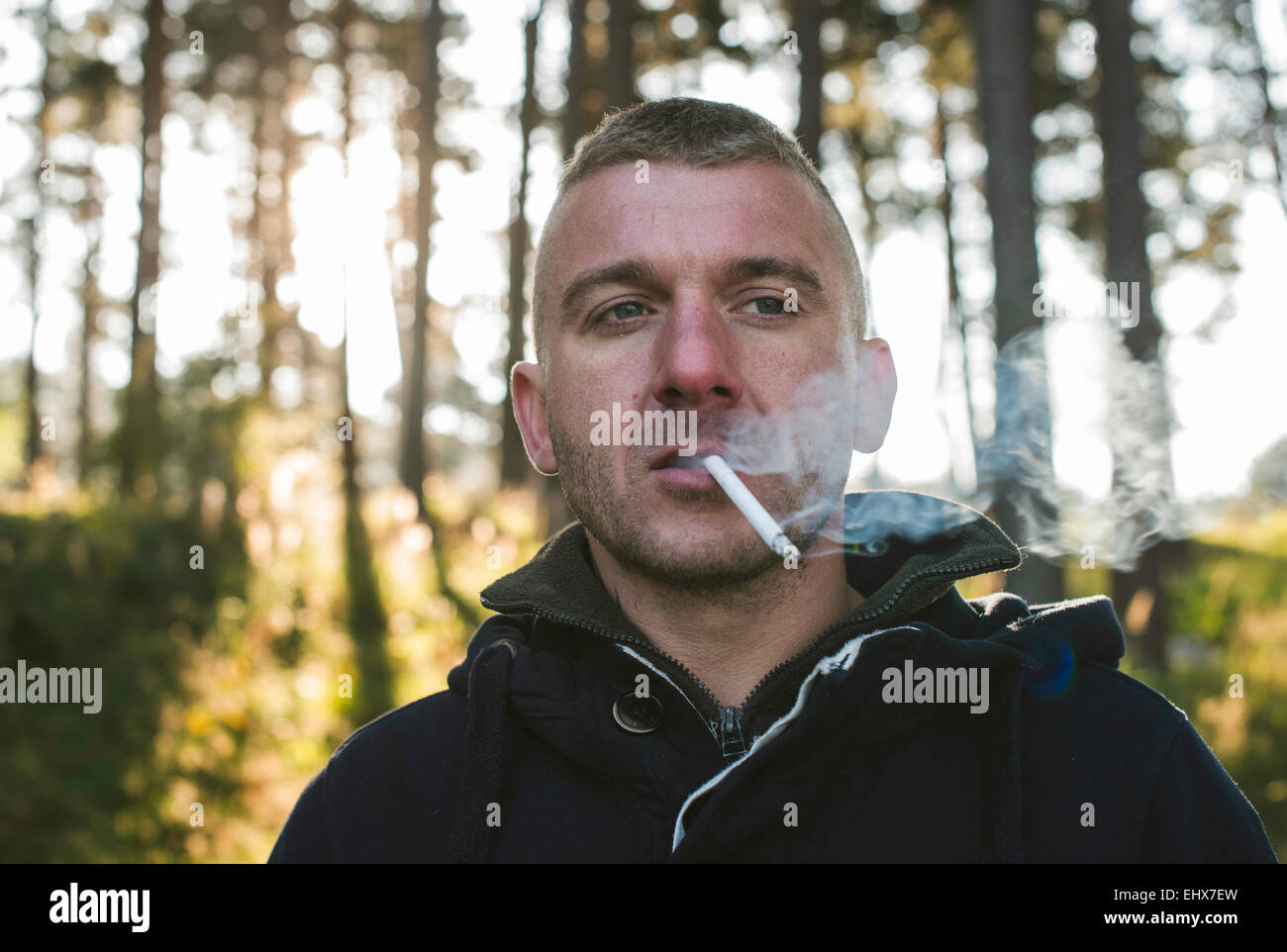 Bulgaria, man smoking cigarette in the forest Stock Photo - Alamy