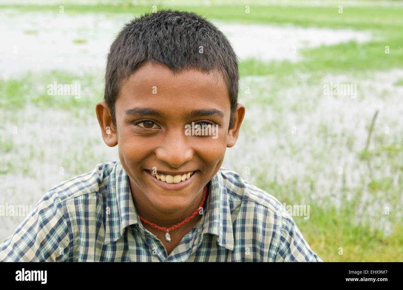 A portrait of a smiling Indian fisherman's boy at a lake Stock Photo ...