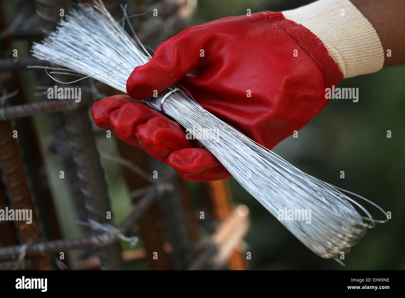 Construction wire holding by hand Stock Photo - Alamy