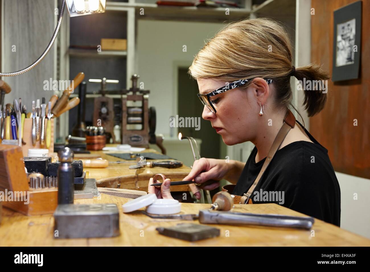 Goldsmith in workshop at work Stock Photo - Alamy