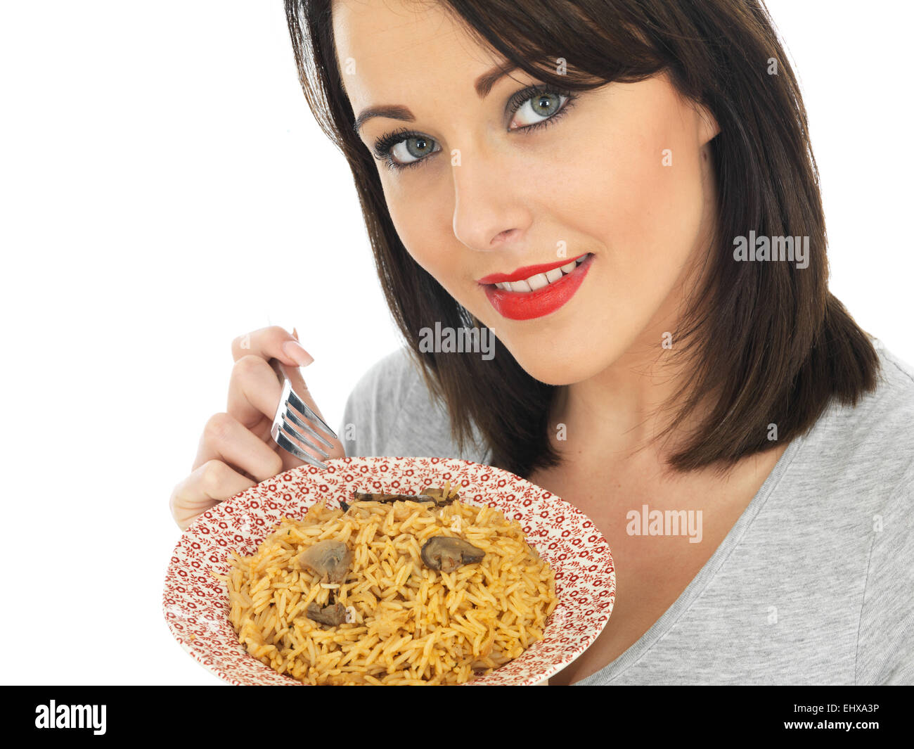 Attractive Young Woman Eating Mushroom Rice Stock Photo - Alamy