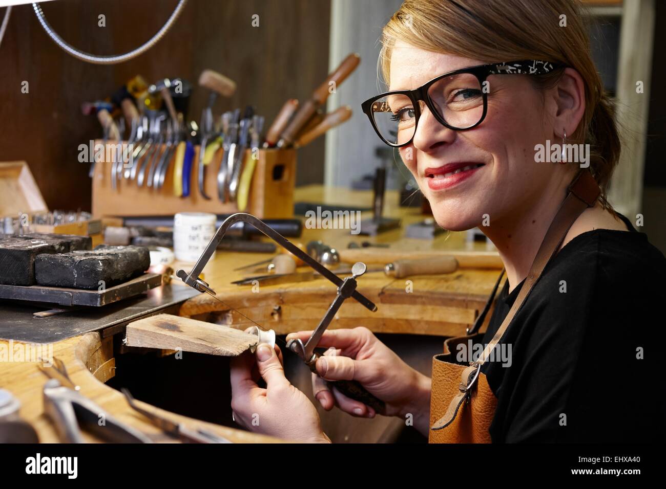 Goldsmith working with saw hi-res stock photography and images - Alamy