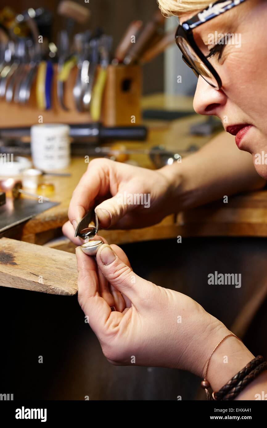 Goldsmith in workshop at work Stock Photo - Alamy