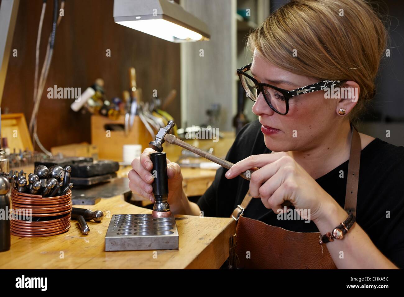 Goldsmith in workshop at work Stock Photo - Alamy